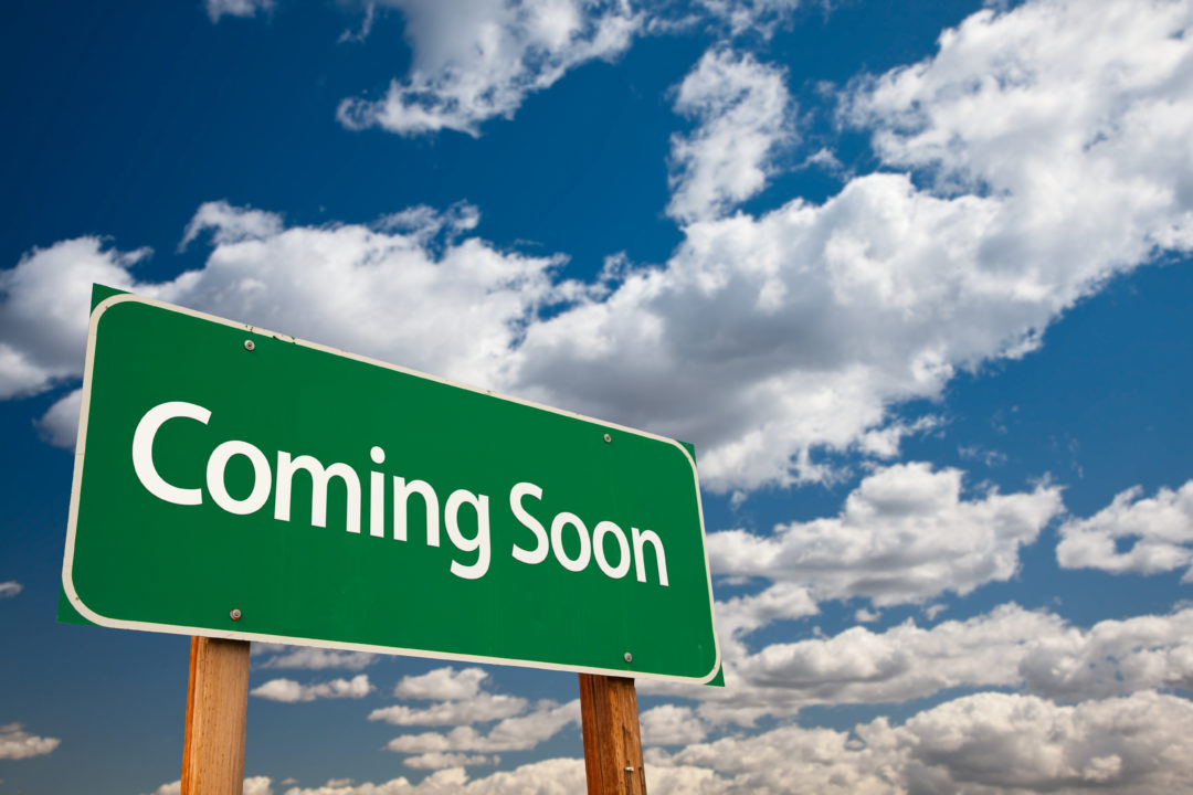 Coming Soon Green Road Sign with Copy Room Over The Dramatic Clouds and ...